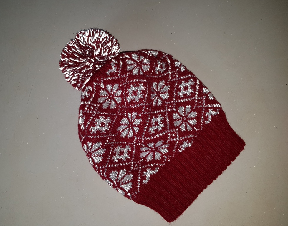 Bērnu cepure saulītes rakstā